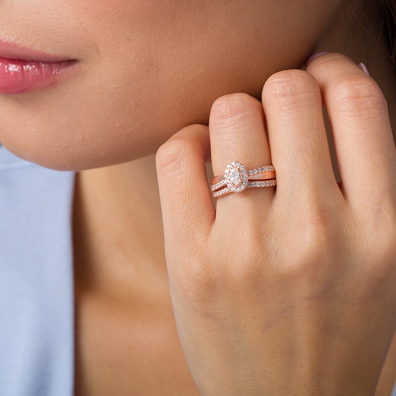 Previously Owned - 3/4 CT. T.W. Oval Diamond Frame Crossover Bridal Set ...